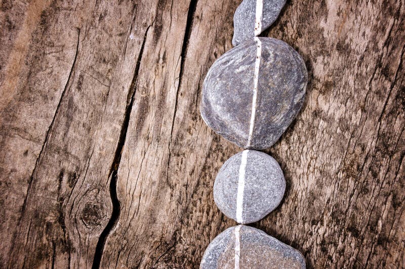Lign of stones on wood stock photo. Image of space, pebble - 51243786