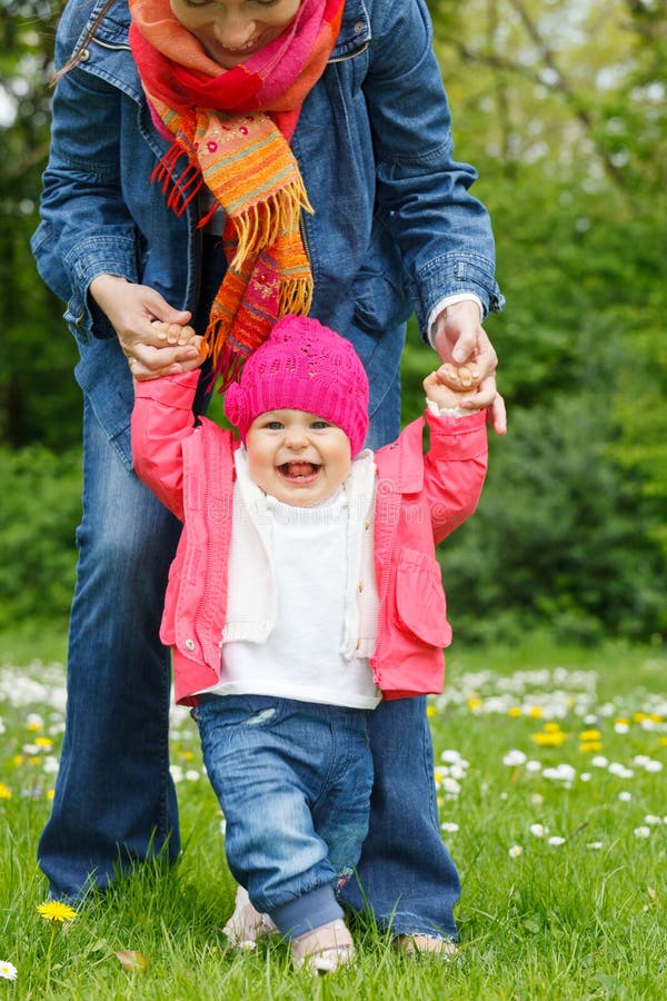 Baby s first steps stock image. Image of baby, flowers - 25866223