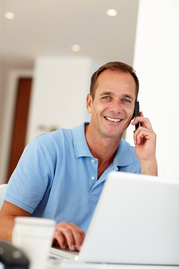 Like a Boss. a Businessman Happily Working from Home. Stock Photo ...