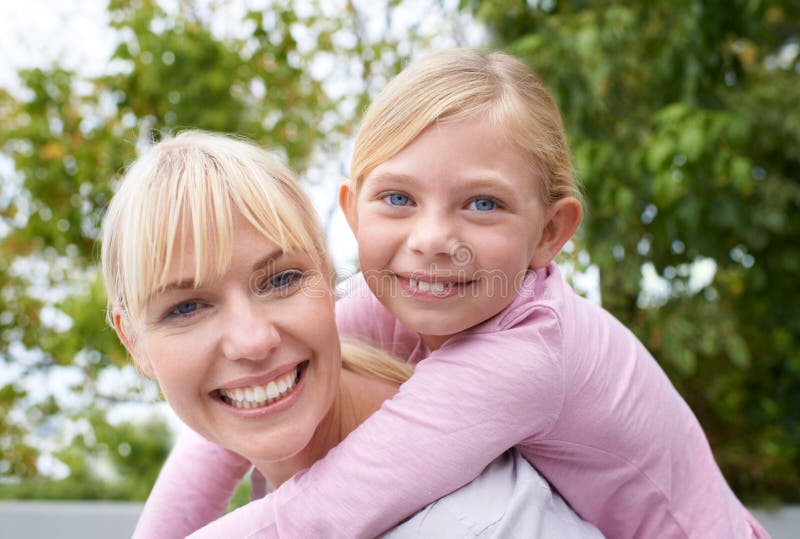 Like Mother Like Daughter. a Happy Young Mother Giving Her Daughter a ... Like Mother Like Daughter. a Happy Young Mother Giving Her Daughter a ...