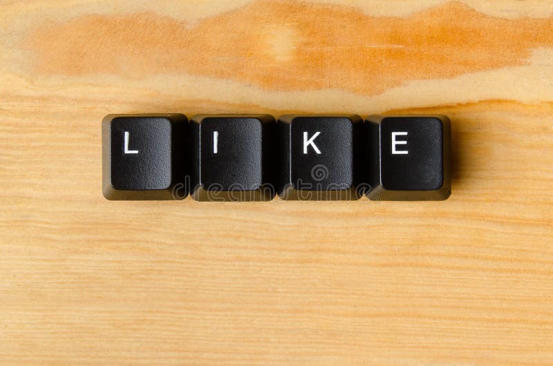 Like Word with Multicolored Heart Stones Over Beach Sand Stock Image ...