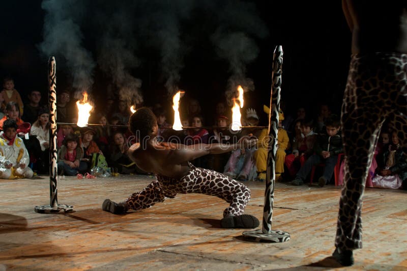 Limbo dance under the fire editorial image. Image of fire - 23593725