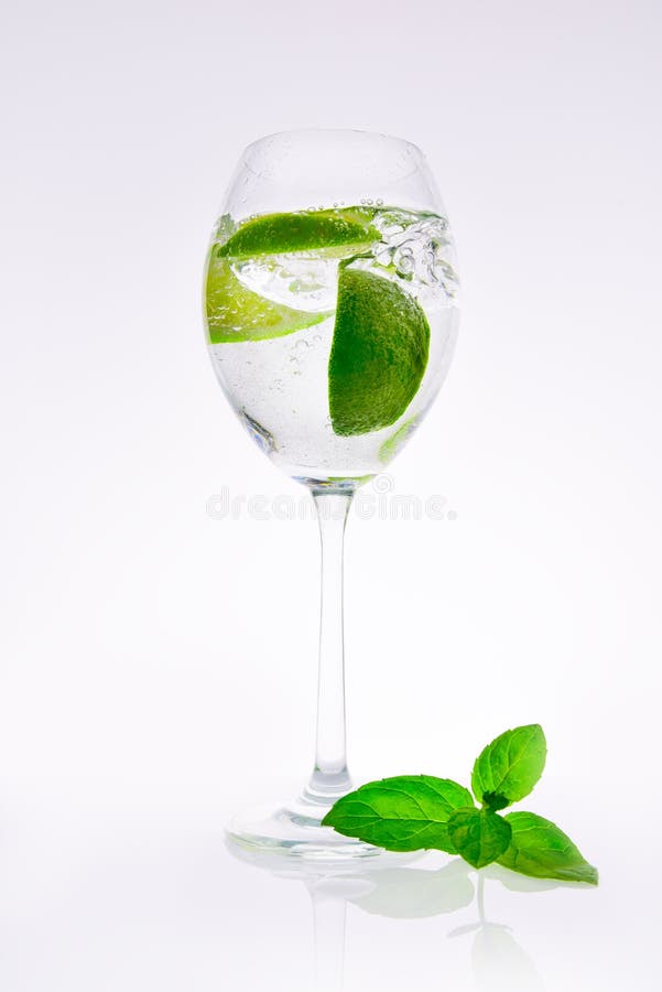 Lime in Carbonated Water with a Mint Leaf Stock Image - Image of lemon ...