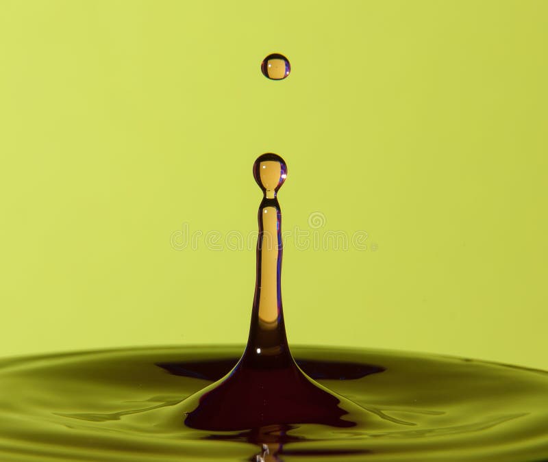 Lime green water drop stock image. Image of bounce, collision - 79647361