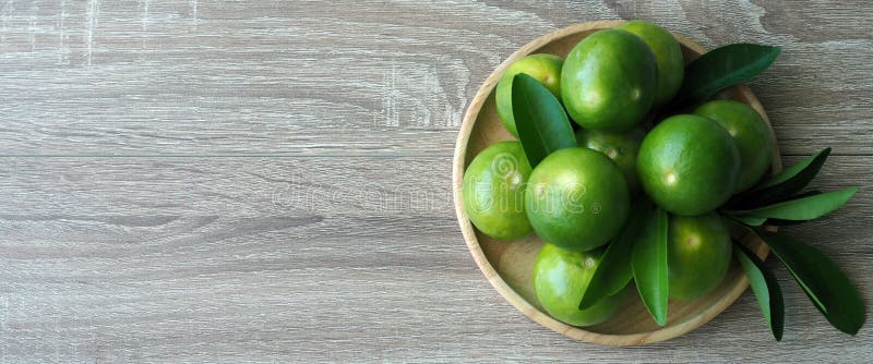 Lime Placed on a Wooden Plate Stock Photo - Image of fruit, plate ...