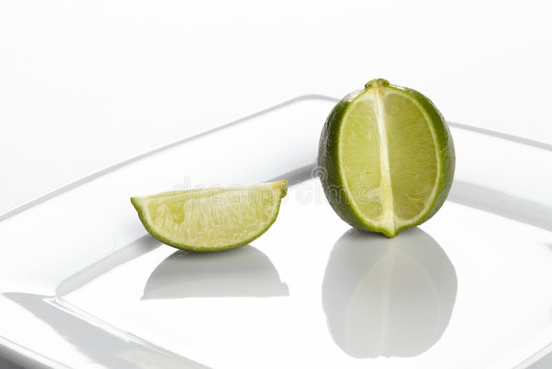 Lime on a plate stock image. Image of cutted, plate, quarter - 31370335