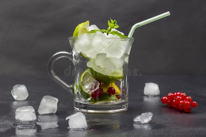 Lime, Red Currant, Mint, Ice and Straws in a Glass Stock Image - Image ...
