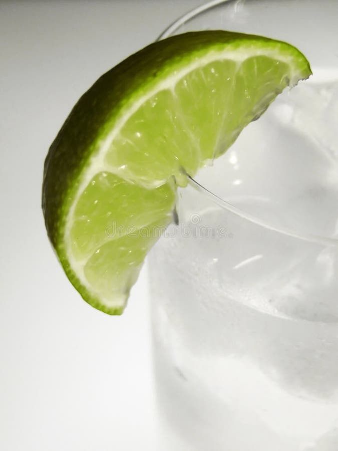 Lime wedge and cool drink stock photo. Image of alcohol - 195788