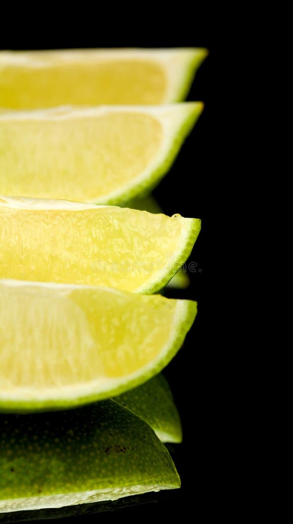 Limes on black mirror stock photo. Image of reflection - 53625660