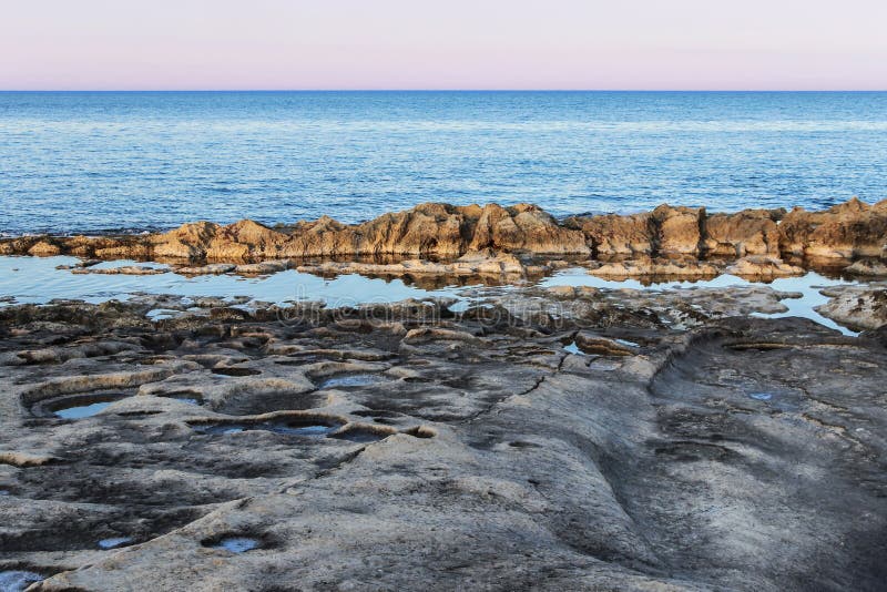 Limestone Beach in Malta at Sunset Stock Photo - Image of rock, clear ...