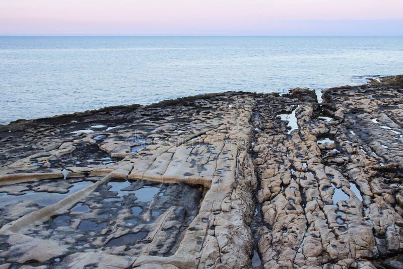 Limestone Beach In Malta At Sunset Stock Photo - Image of shore, water ...