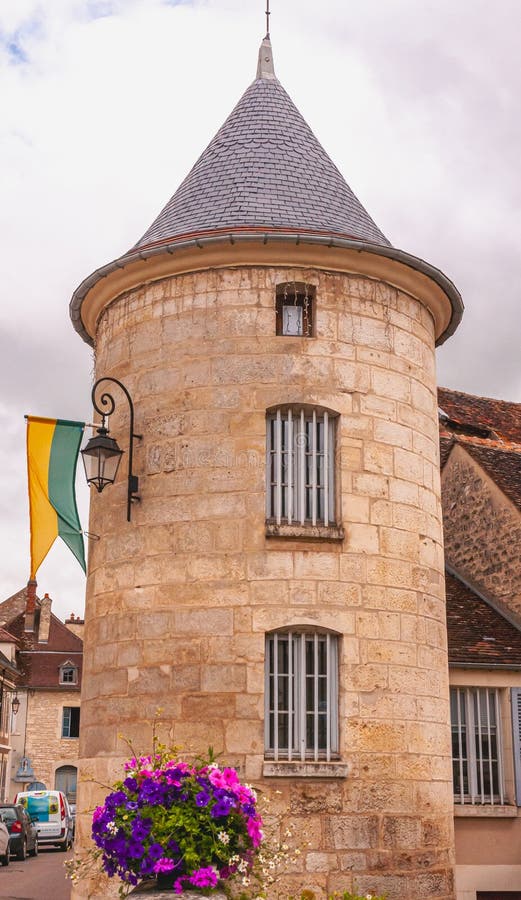 Limestone Block Tower, Flag and Flowers, in France Stock Photo - Image ...