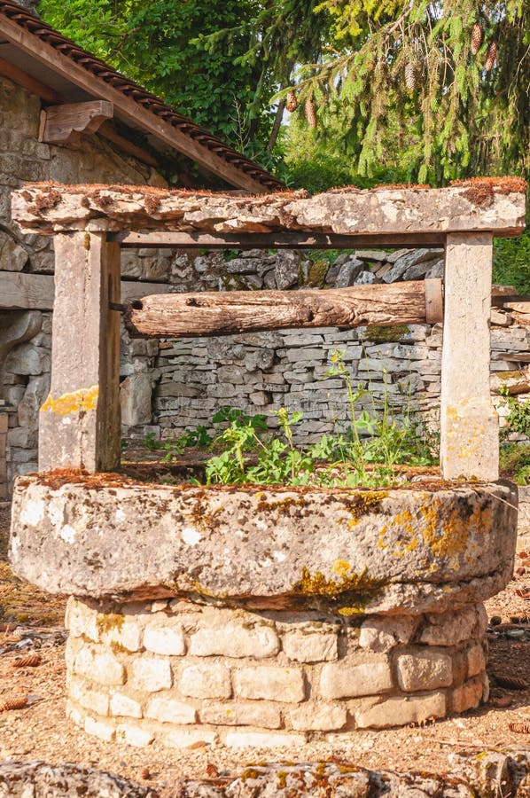 Limestone Block Water Well with Wood Rope Spool and Frame Stock Photo ...