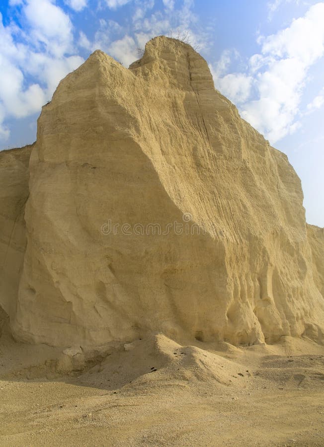 Limestone cliff in quarry stock photo. Image of cliff - 63105680