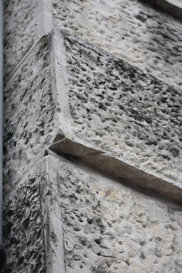 Limestone Coin Corner Stone Stock Photo - Image of street, iron: 274886250