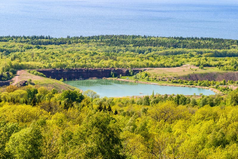 Limestone Quarry with a Lake and Forest Stock Photo - Image of horizon ...