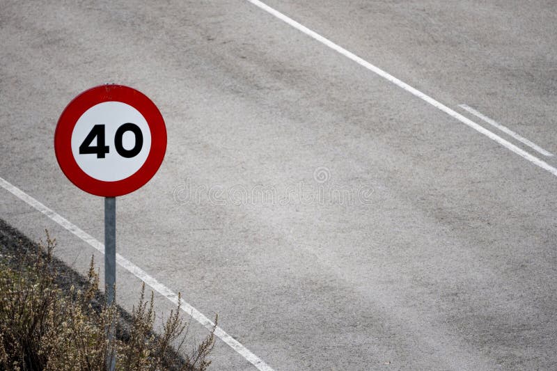 A Limited Speed Sign on the Side of a Road Stock Photo - Image of ...