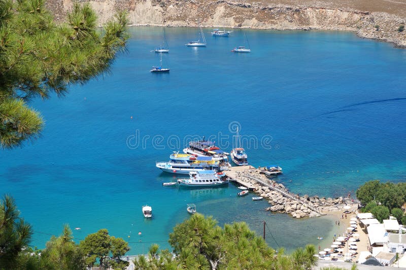 Lindos Bay and boat stock photo. Image of rodos, outdoors - 72942054