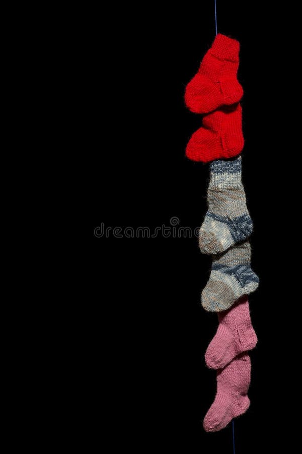 Line of Baby Socks on Black Stock Image - Image of background ...
