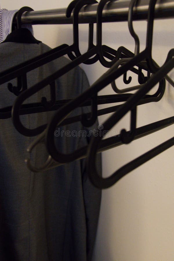 Line of Black Plastic Empty Coat Hangers Stock Image - Image of shop ...