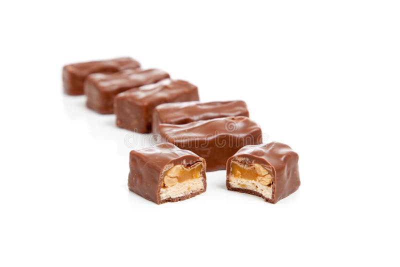 Line of Chocolate Candies on a White Background Stock Image - Image of ...