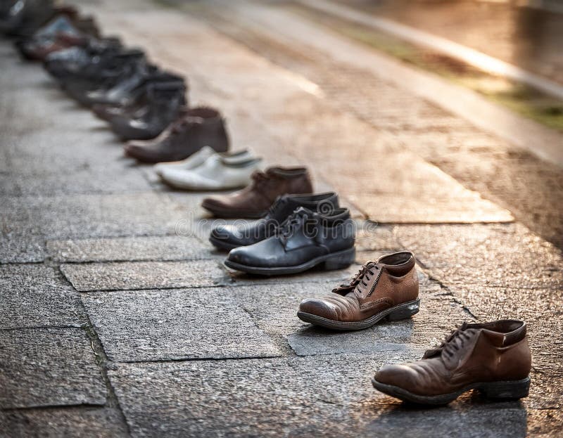 A Line of Empty, Worn Shoes Representing Homelessness and Lack of ...