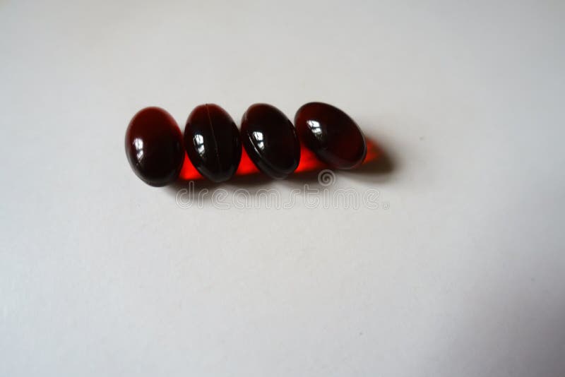 Line of Four Red Capsules of Krill Oil Stock Image - Image of ...