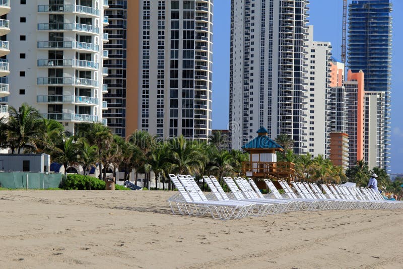 Line of High Rises and Lounge Chairs Along the Beach Stock Image ...