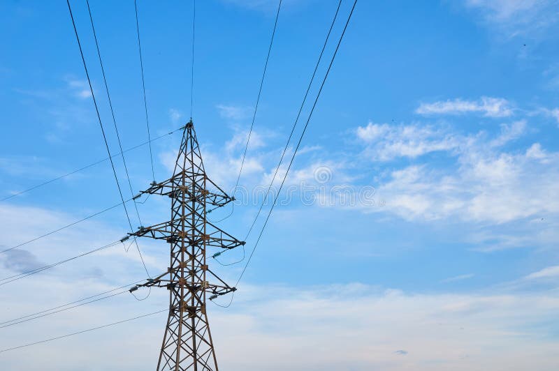 A Line of High-voltage Cables Against a Blue Sky with Clouds. Stock ...