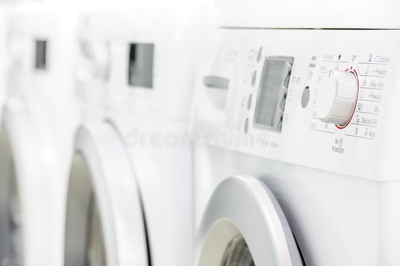 Line of laundry machines stock image. Image of store - 55160365