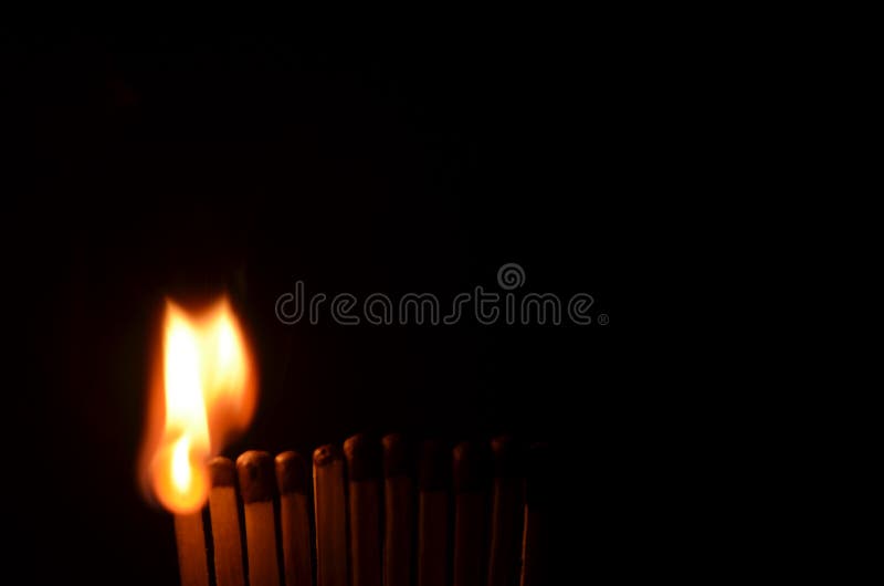 Line of Lighted Matches on Black Background Stock Photo - Image of ...