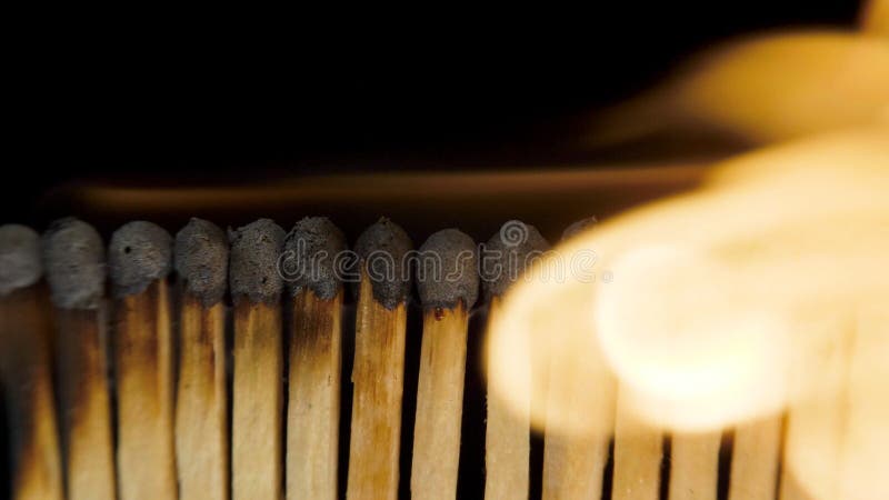 Line of Lighted Matches on Black Background Stock Video - Video of ...