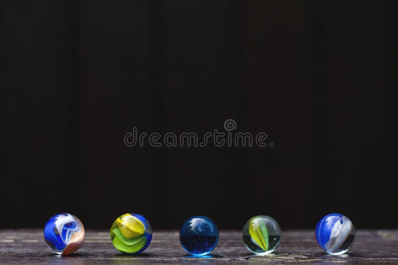 Line of marbles stock image. Image of marbles, dark, collection - 86688425
