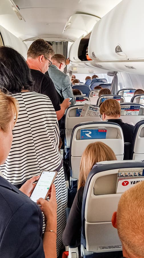 A Line of Passengers Waiting To Exit after Boarding Editorial Stock ...
