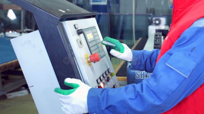Line Production of Plastic Windows. Worker in Workshop. Worker Clicks ...