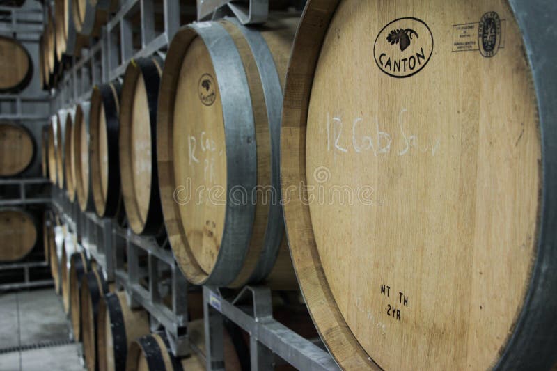 Line Row of Wine Barrels on Metal Crates on Top of One Another ...