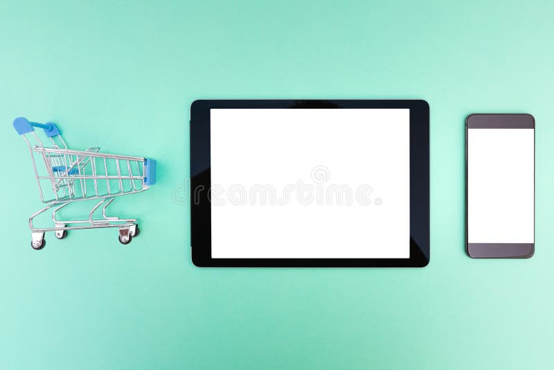 On-line Shopping Concept - Tablet and Empty Shopping Cart on Light Blue ...