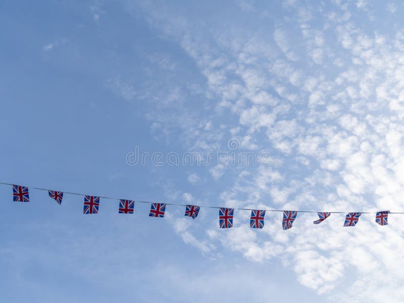 A Line of Union Jack Bunting Flags, Stretched Across a Summer Sky ...