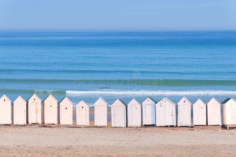 Line of White Beach Cabins, Ocean in the Background Stock Photo - Image ...