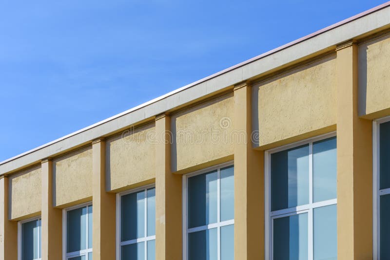 Line of Windows in a Yellow Building Stock Image - Image of lines ...