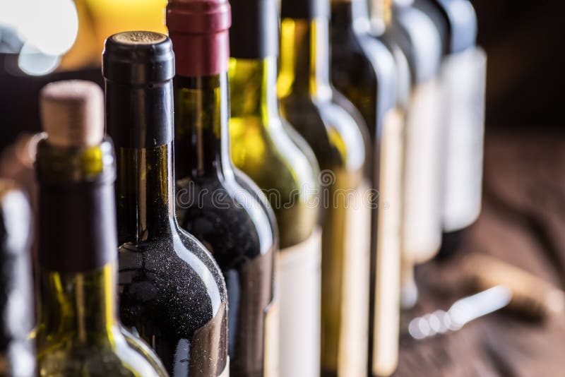 Line of Wine Bottles. Close-up Stock Image - Image of brown, cellar ...