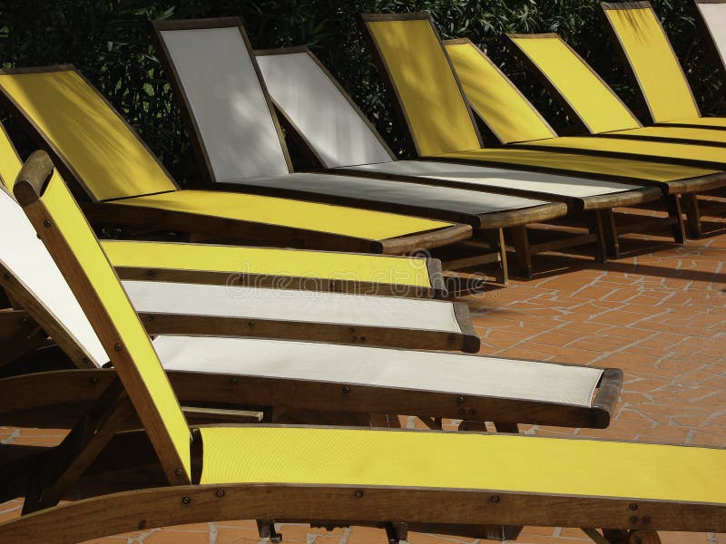 Line of Yellow and White Sun Loungers Stock Image - Image of chair ...