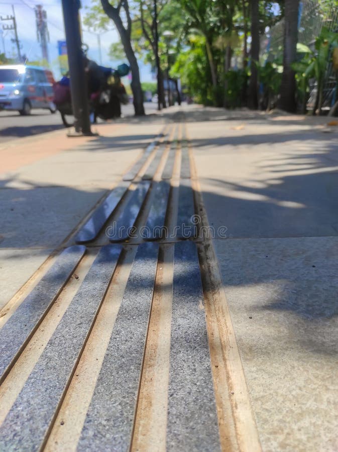 The Linear Pattern of Gray Guiding Blocks on Pedestrians. Stock Image ...