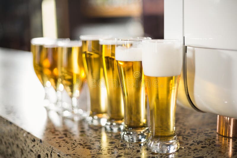 Lined up beers on table stock image. Image of metallic - 67729263