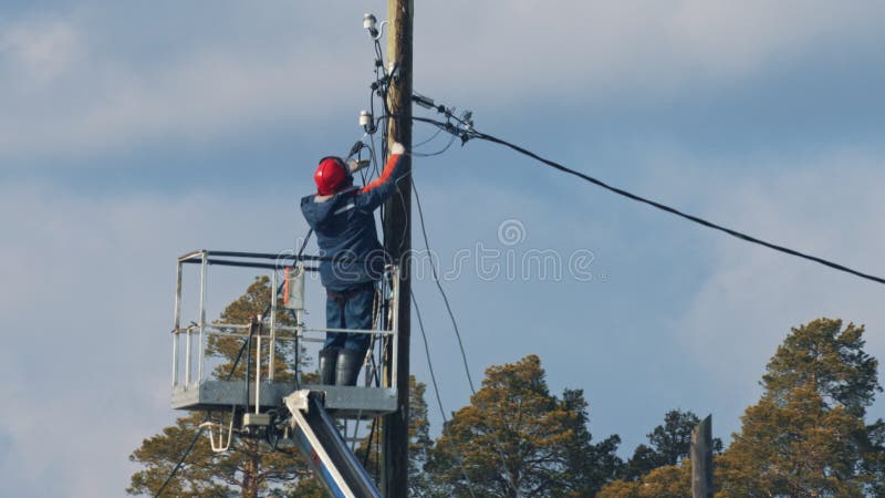 Lineman Working on Electrical Pole Using a Lift Platform Stock Video ...