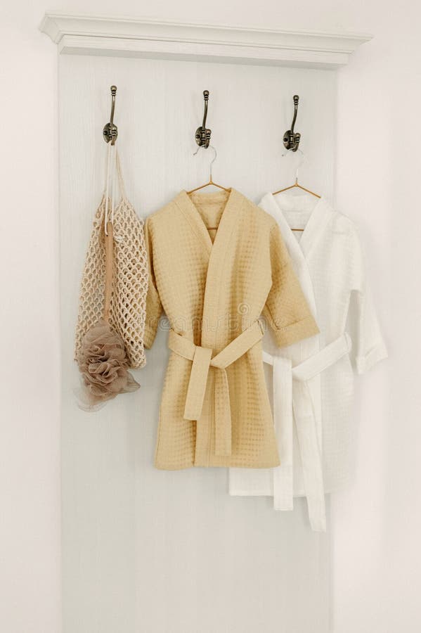 Linen Bathrobes Hang on a Hanger in the Bathroom Stock Photo - Image of ...