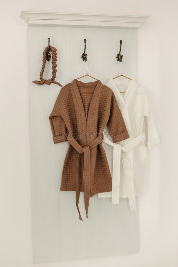 Linen Bathrobes Hang on a Hanger in the Bathroom Stock Image - Image of ...