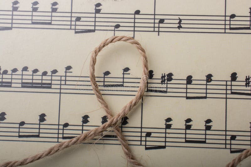 Linen Thread Placed on Paper with Musical Notes Stock Image - Image of ...