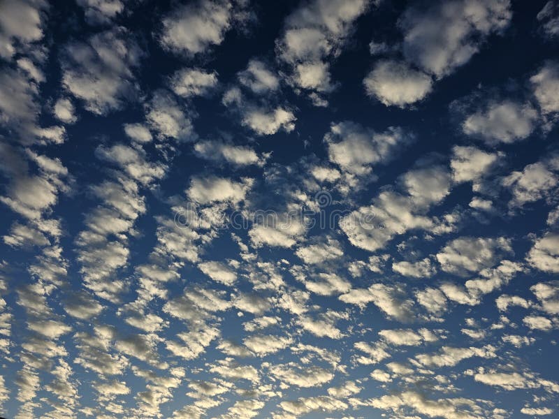 Lines of Altocumulus Clouds Cover the Deep Blue Sky Above! Stock Photo ...