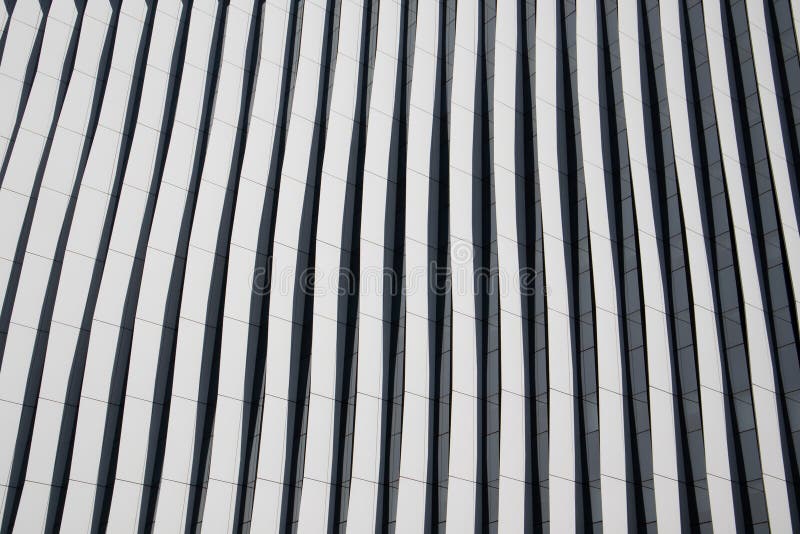 Facade of Tall Modern Building with Contrast Shadows and Long Vertical ...